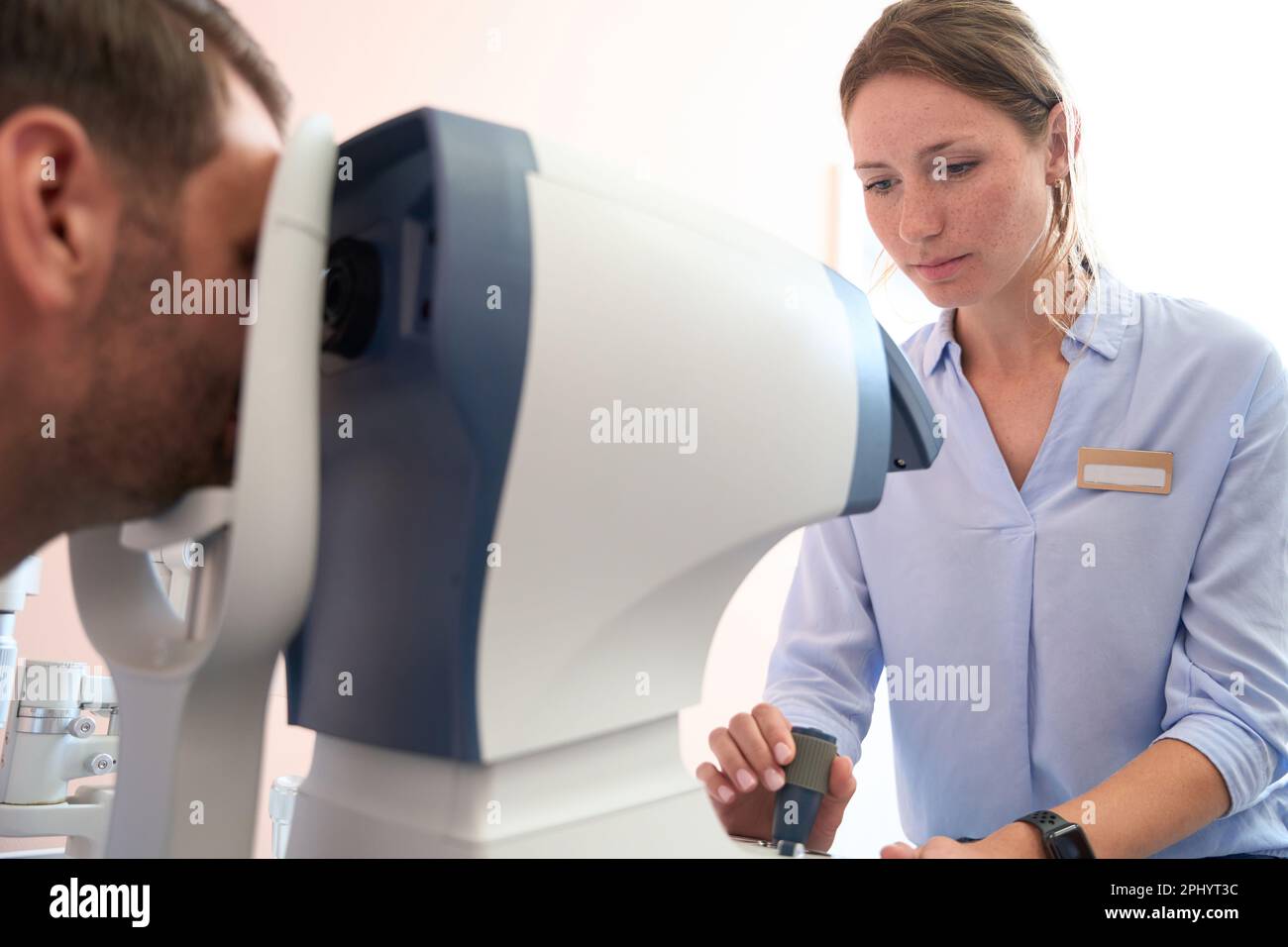 Qualified female ophthalmologist examining visual acuity in the medical ...