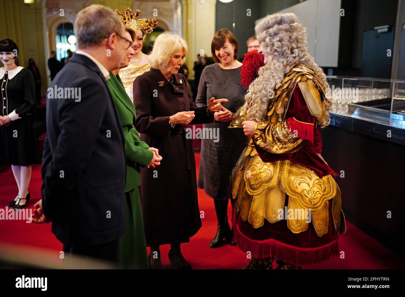 The Queen Consort (centre) and First Lady Elke Budenbender second left ...