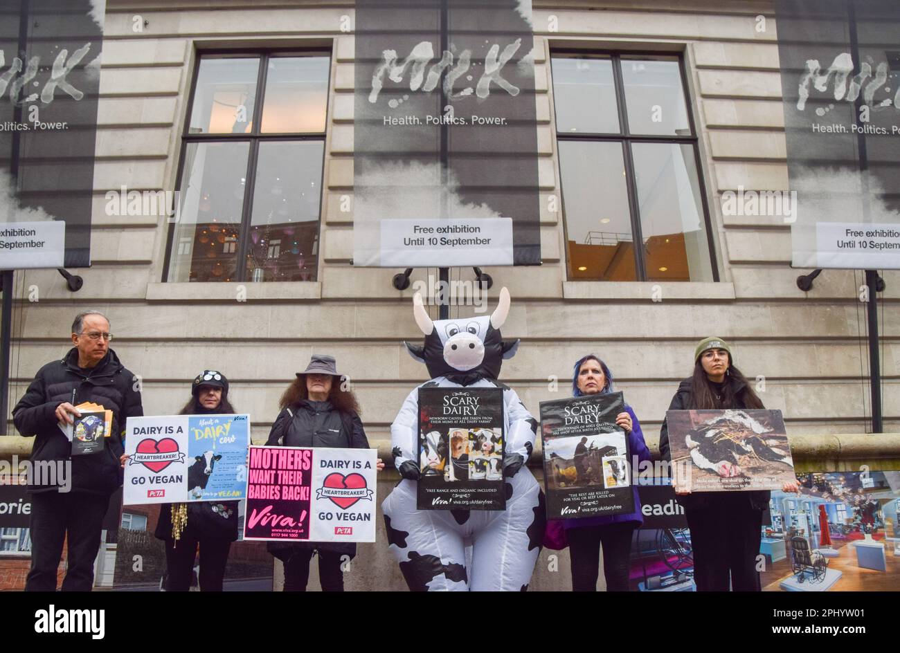 London, UK. 29th Mar, 2023. Protesters hold anti-dairy placards during ...