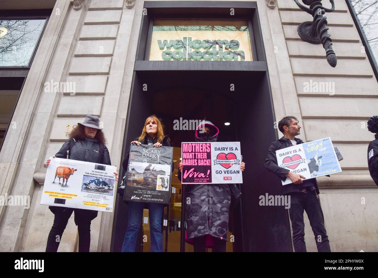 London, UK. 29th Mar, 2023. Protesters hold anti-dairy placards during ...