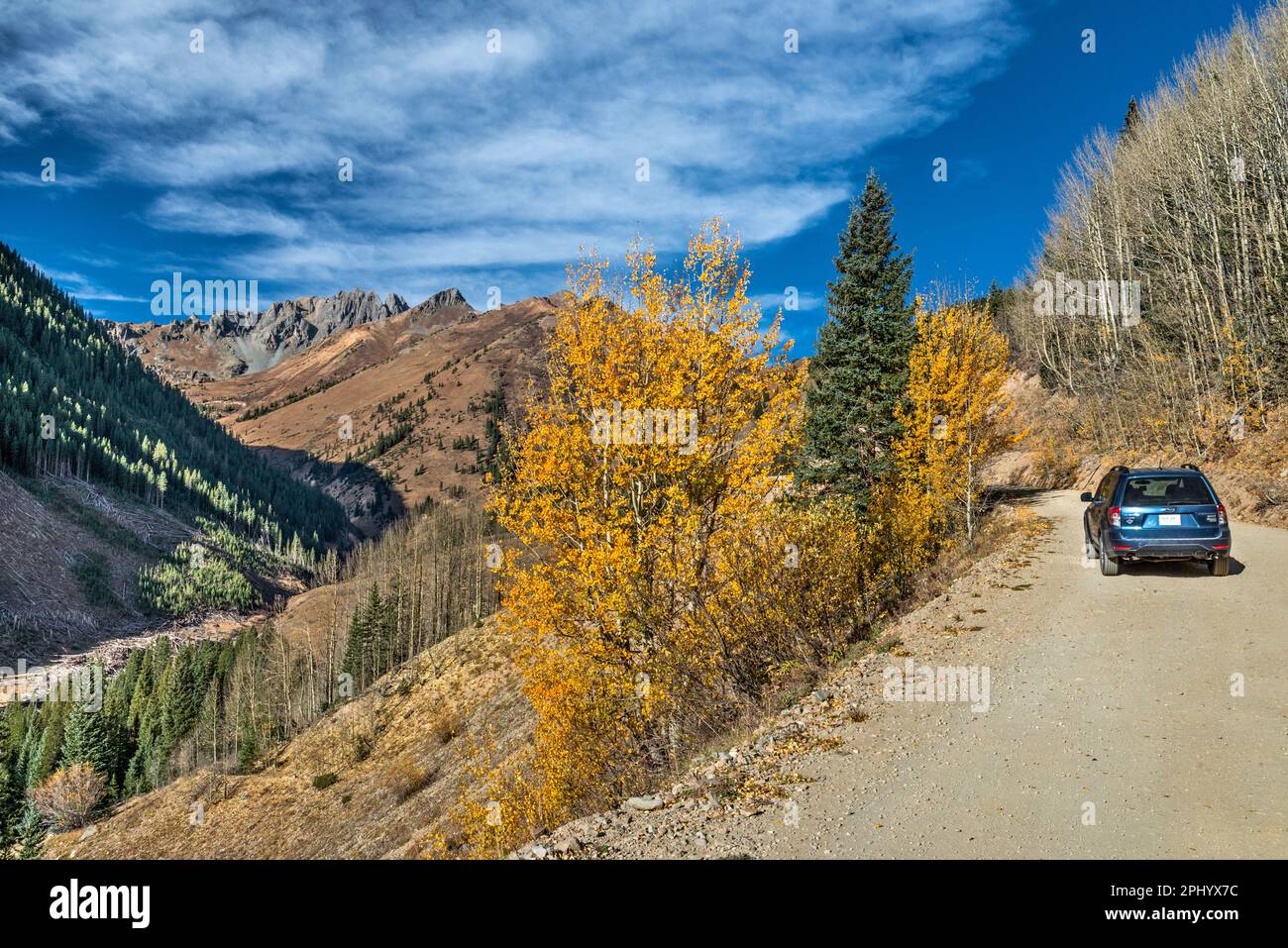 SUV on Ophir Pass Road, peaks over Paradise Basin, San Juan Mountains ...
