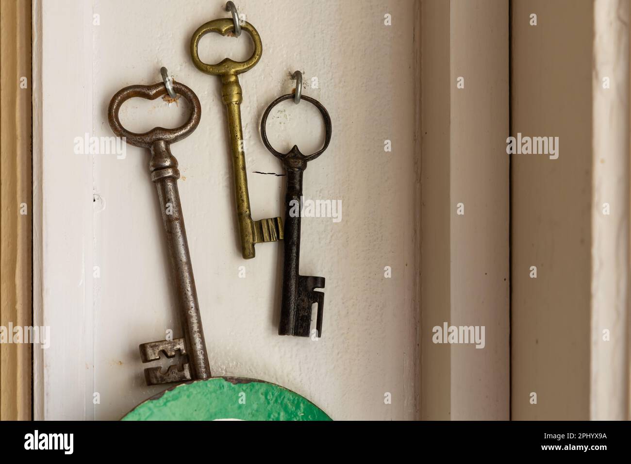 A collection of old steel keys for historical locks. The keys hang on a ...