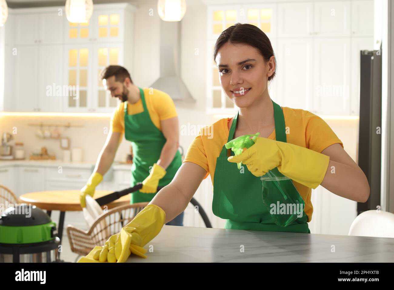 Professional janitors working in apartment. Cleaning service Stock ...