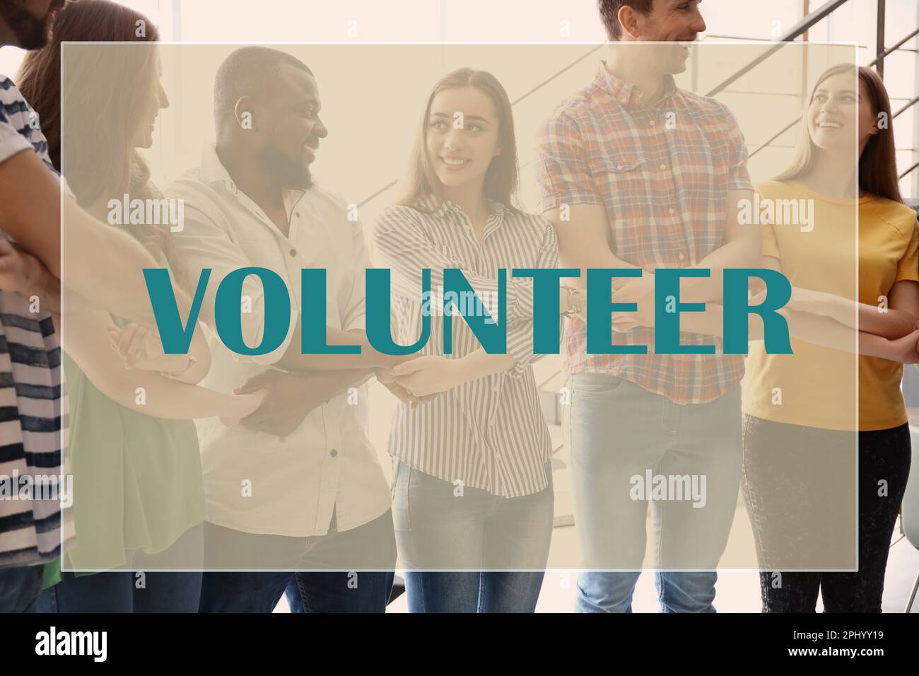 Group volunteers putting hands hi-res stock photography and images - Alamy