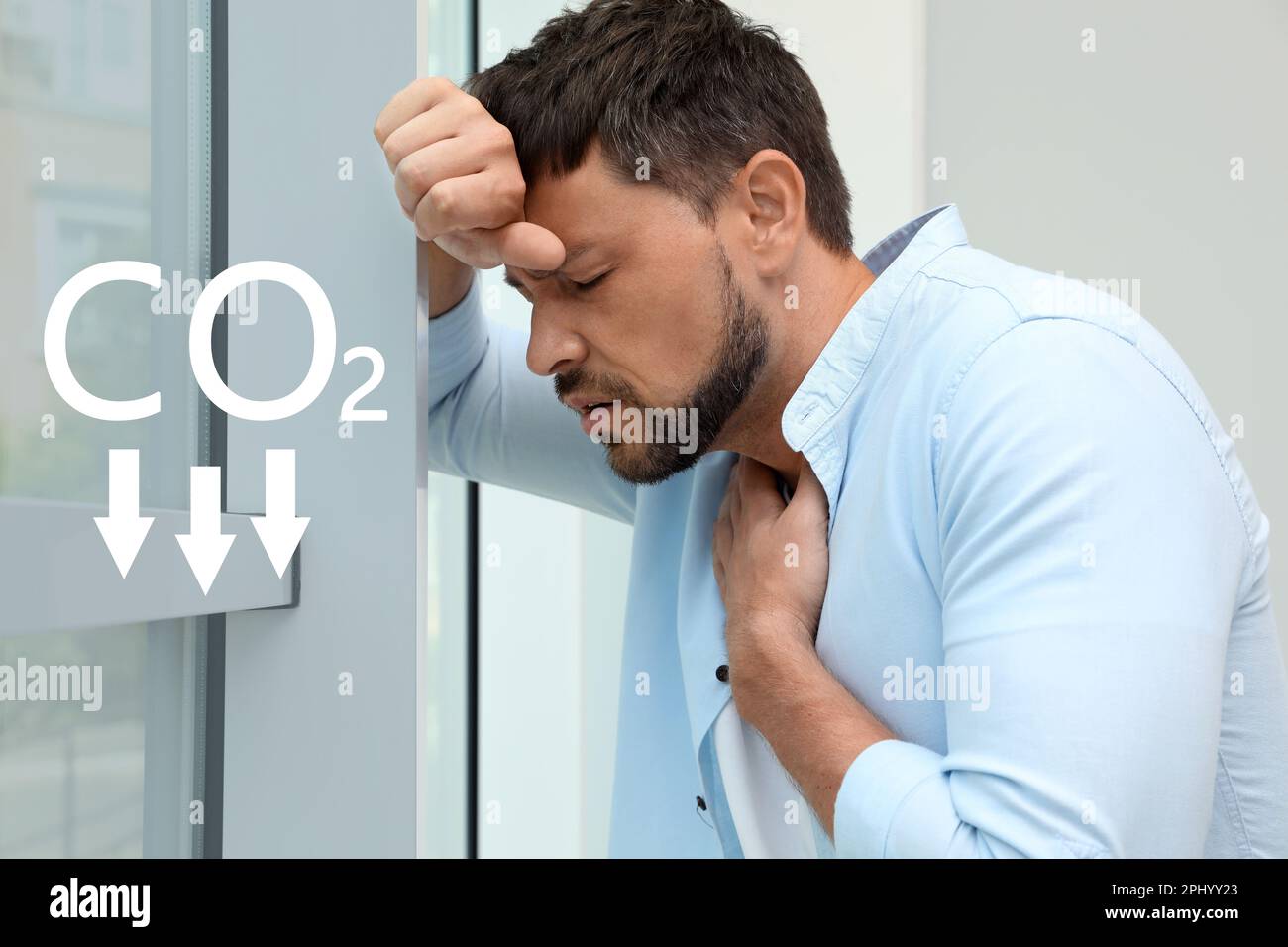 Reduce CO2 emissions. Man suffering from pain during breathing near ...