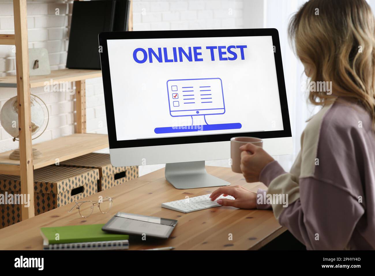Woman taking exam desk hi-res stock photography and images - Alamy