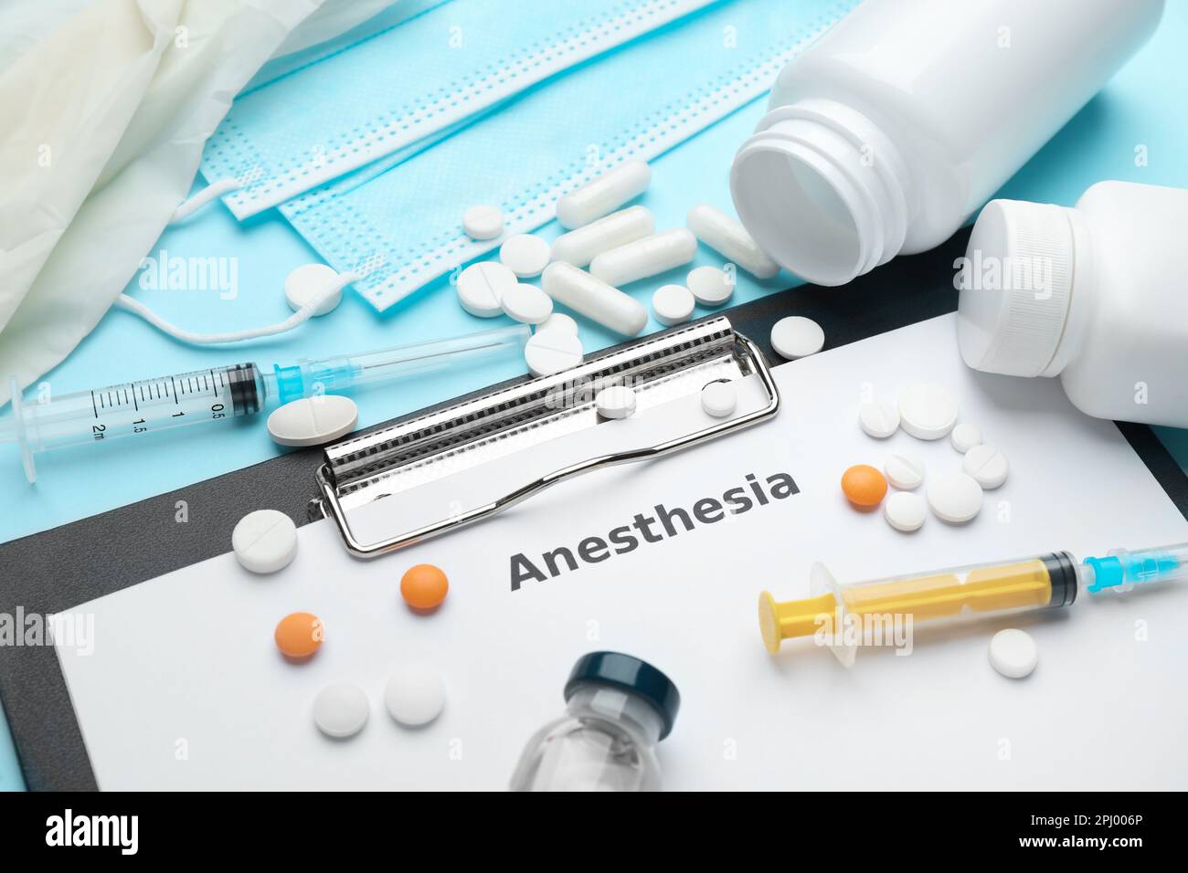 Composition of clipboard with word Anesthesia and drugs on light blue background, closeup Stock ...