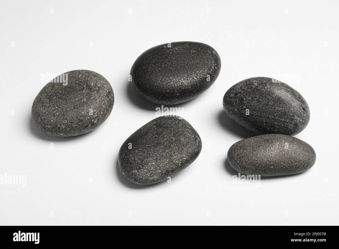 Group of different stones on white background Stock Photo - Alamy