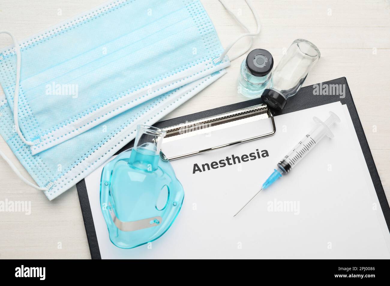 Flat lay composition of clipboard with word Anesthesia and medical ...