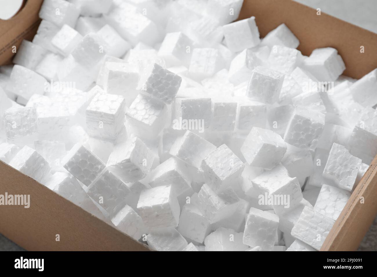 Closeup view of cardboard box with styrofoam cubes Stock Photo - Alamy