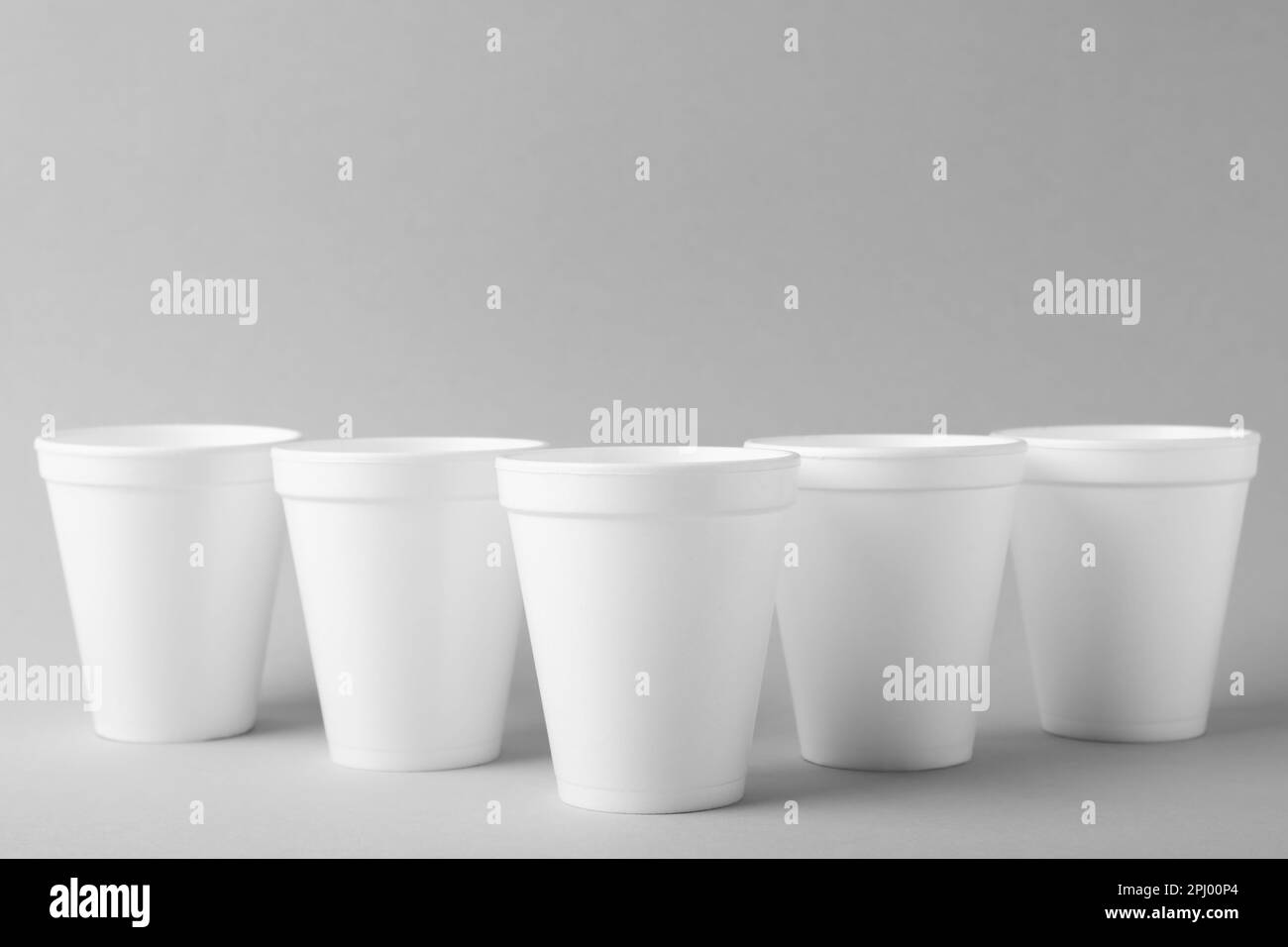 Many takeaway styrofoam cups on light grey background Stock Photo - Alamy