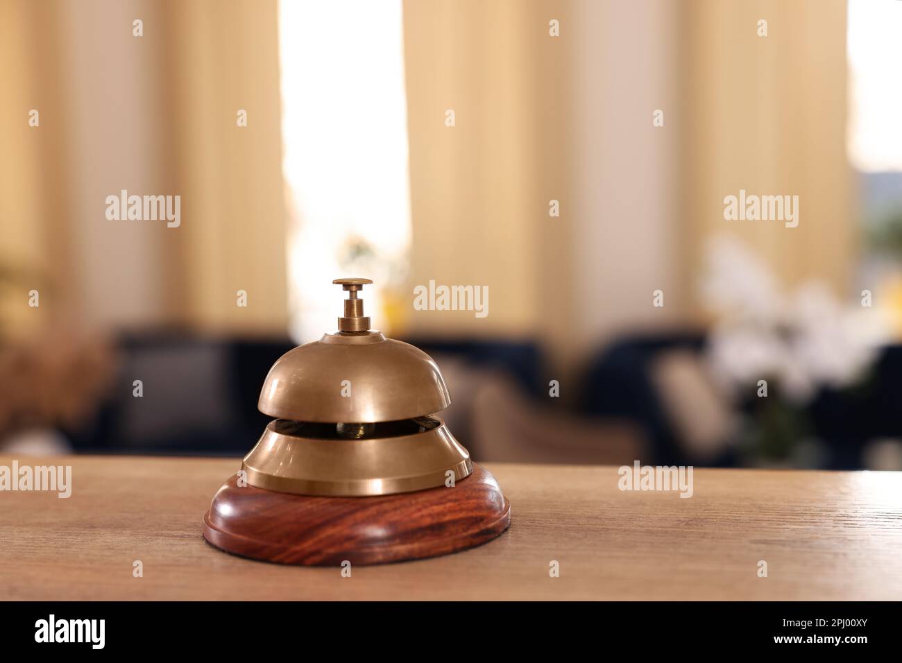 Hotel service bell on wooden reception desk. Space for text Stock Photo ...