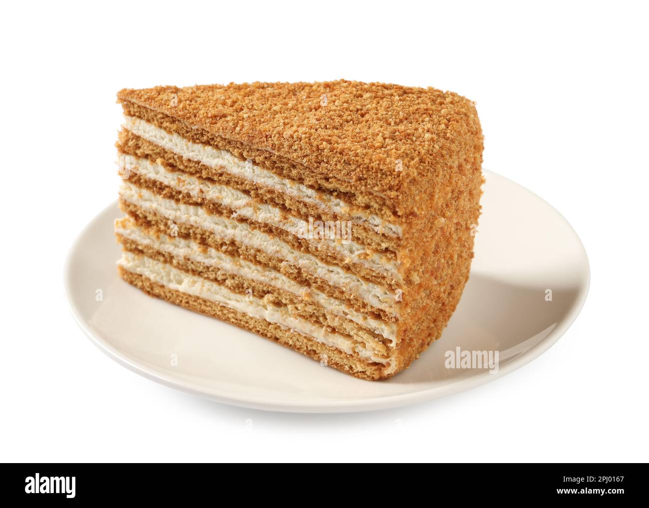 Slice of delicious layered honey cake isolated on white Stock Photo - Alamy
