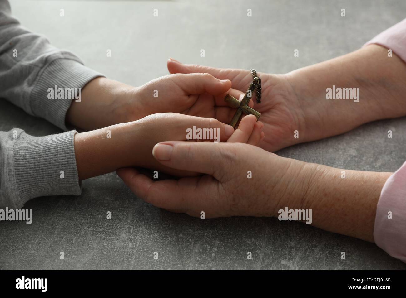 Church boy holding cross hi-res stock photography and images - Alamy