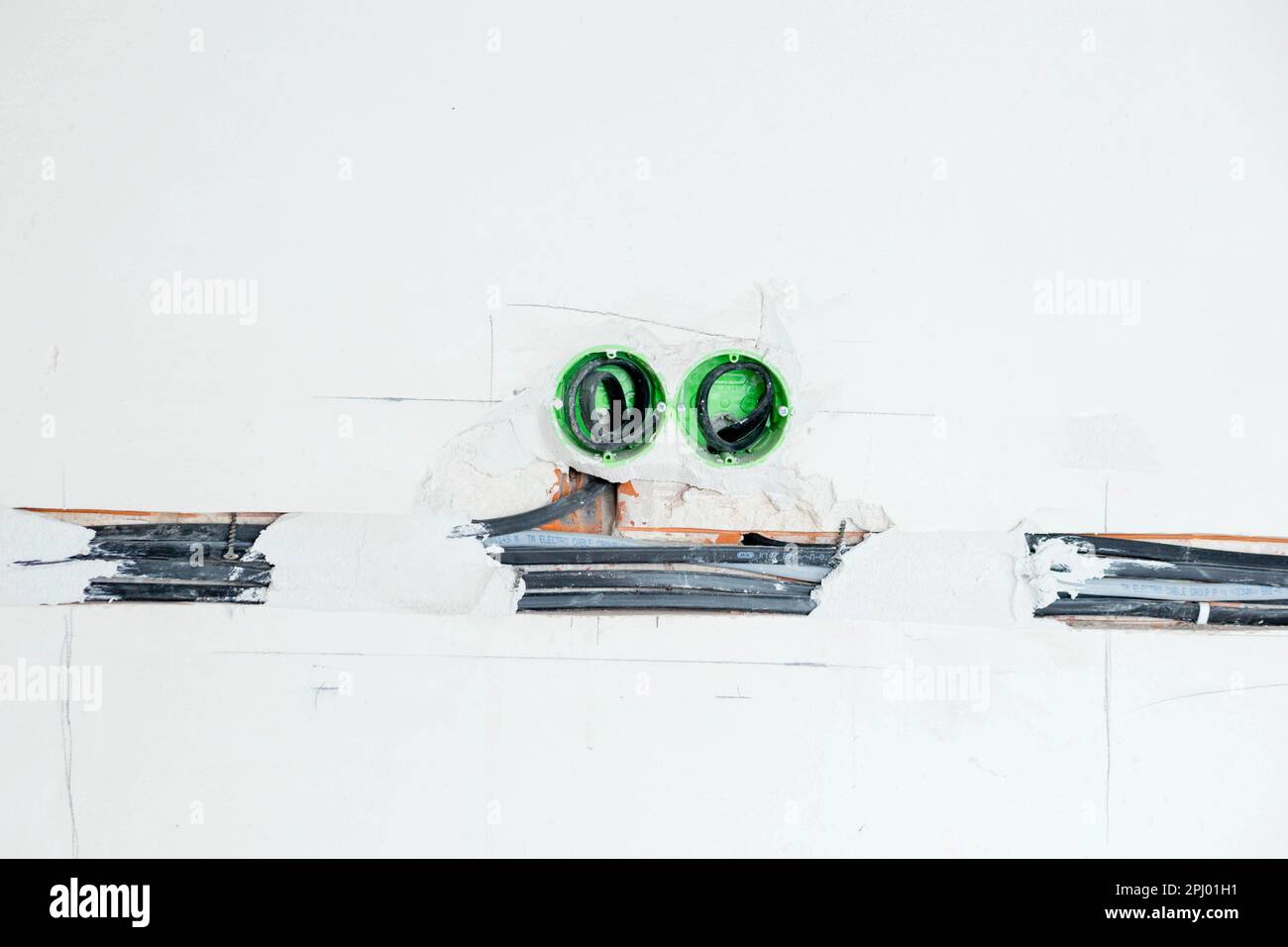 Professional installation of electrical wiring, plastic sockets and ...
