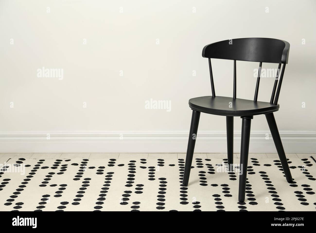 Stylish wooden chair near white wall indoors. Space for text Stock ...