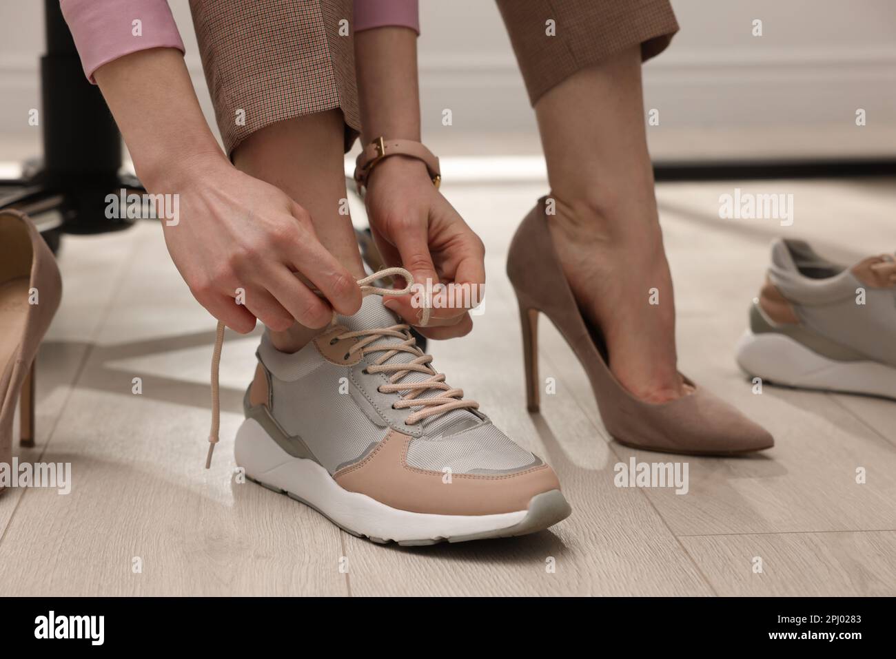 Woman changing her shoes hi-res stock photography and images - Alamy