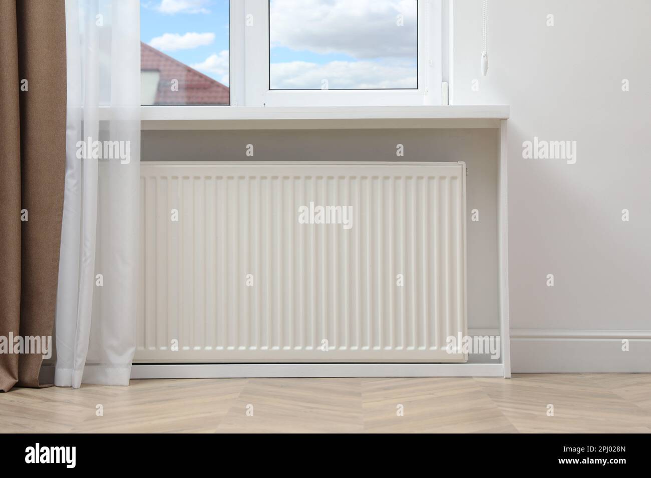 Modern radiator at home. Central heating system Stock Photo - Alamy