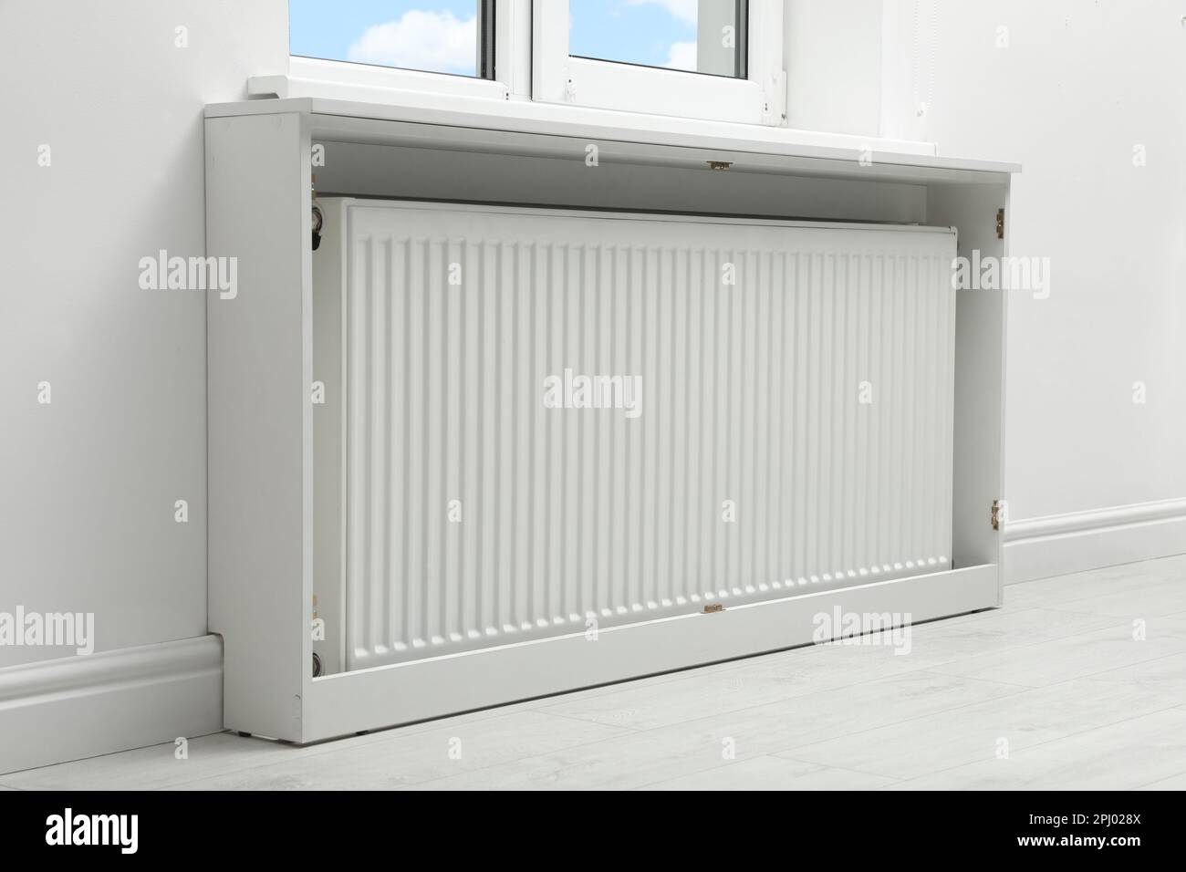 Modern radiator at home. Central heating system Stock Photo - Alamy