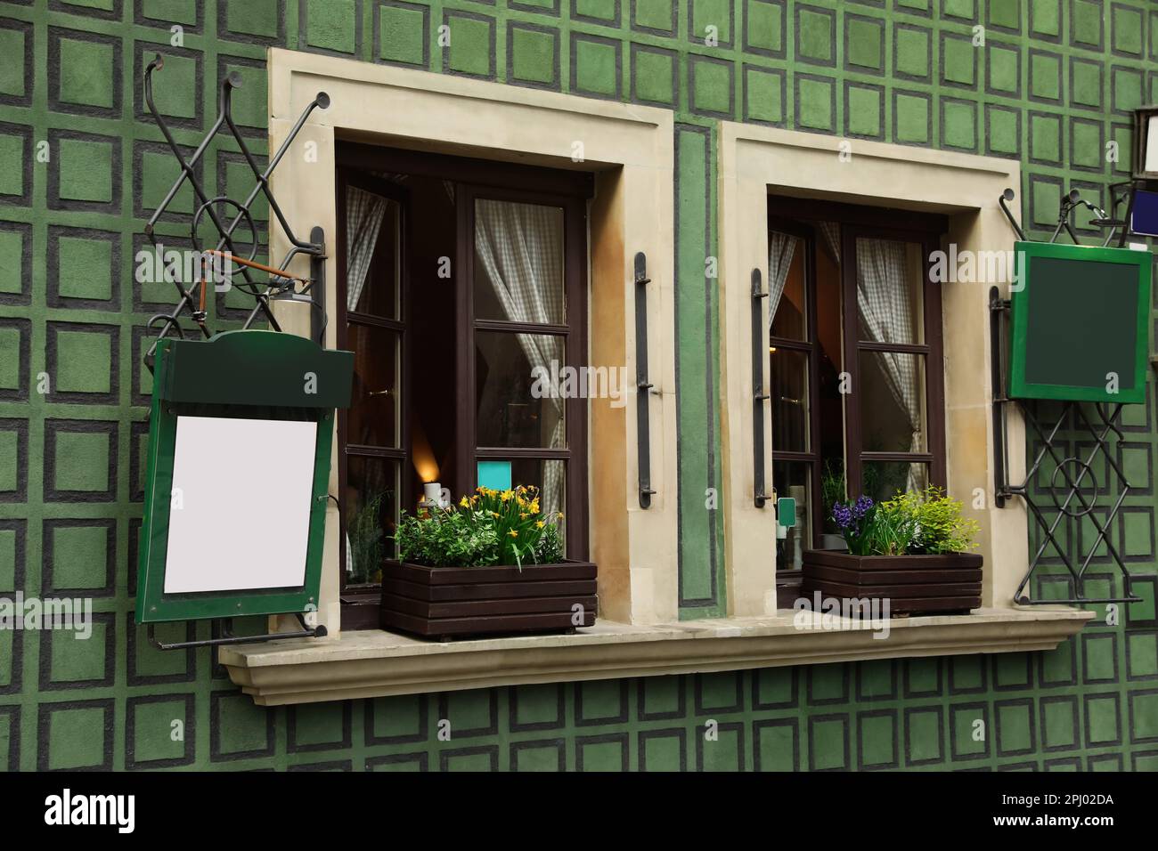 Building with open windows and flower decor, view from outdoors Stock ...