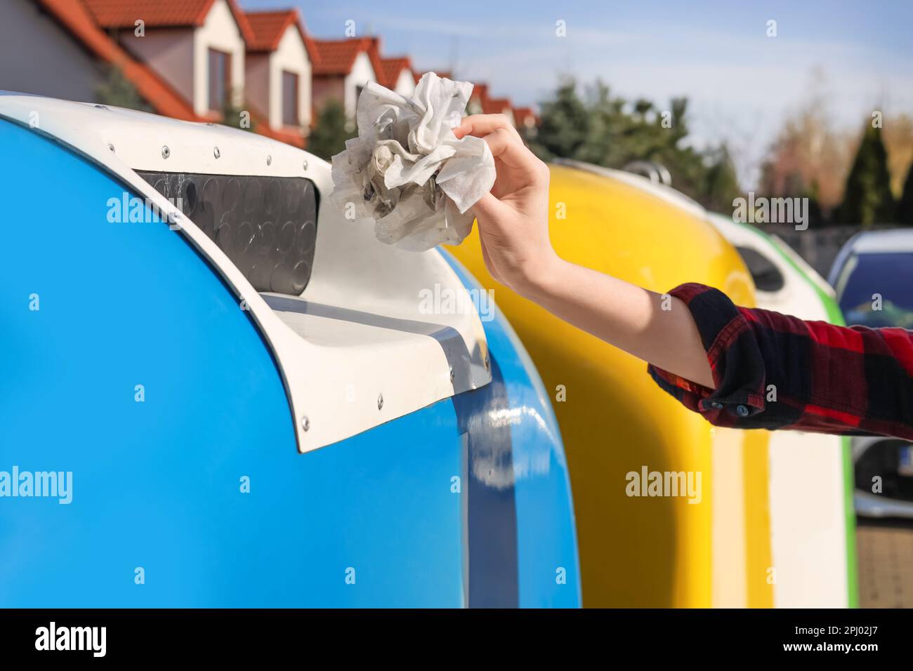 Woman throwing dirty wipes into recycling bin outdoors, closeup Stock ...