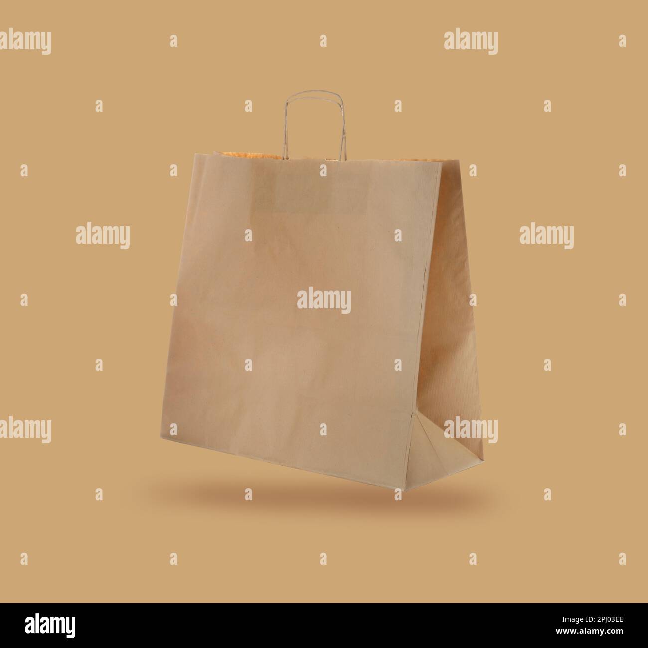 Kraft paper bag on beige background. Mockup for design Stock Photo - Alamy
