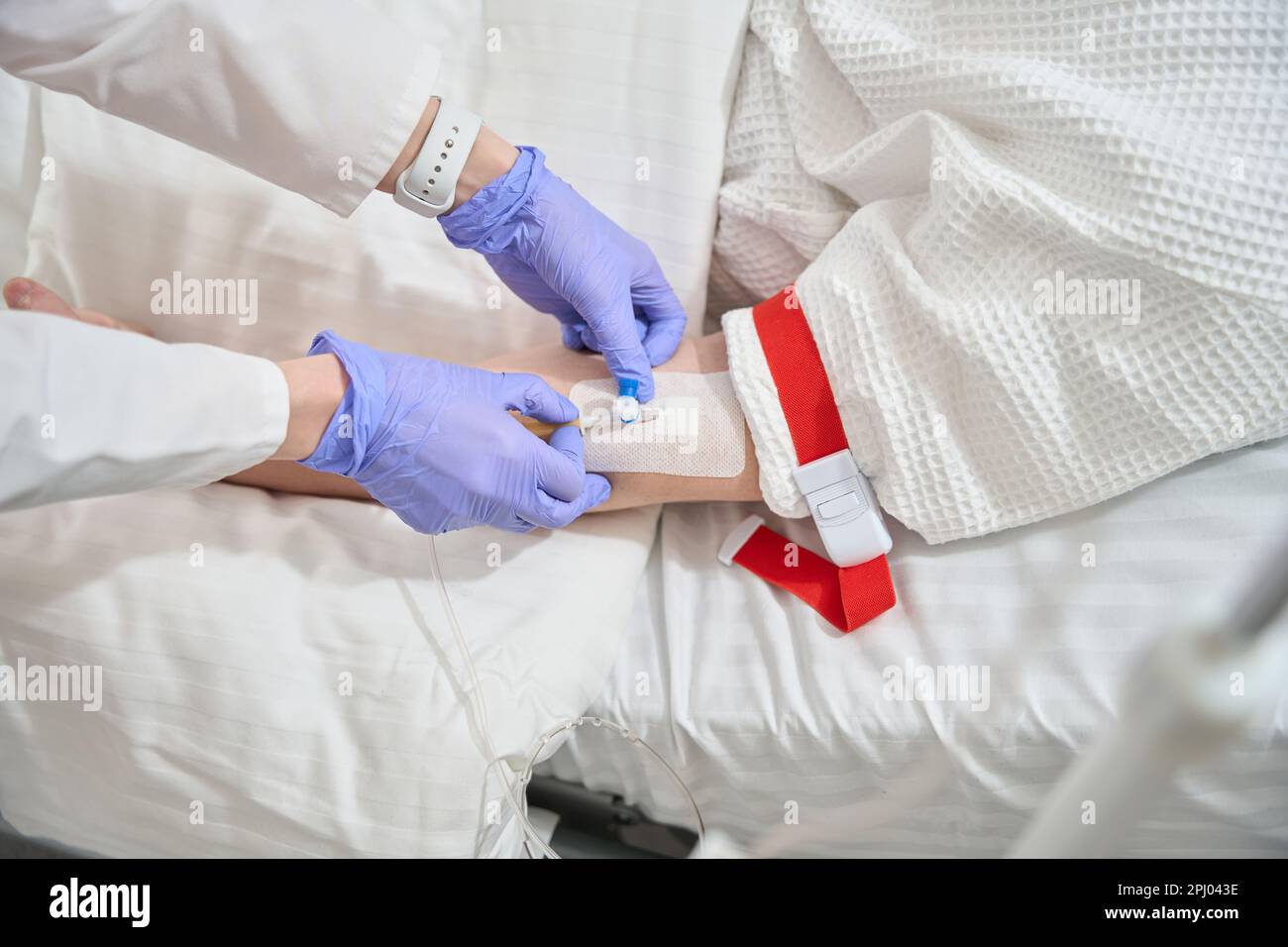 Detail picture of venous catheter in the vein of human hand for blood ...