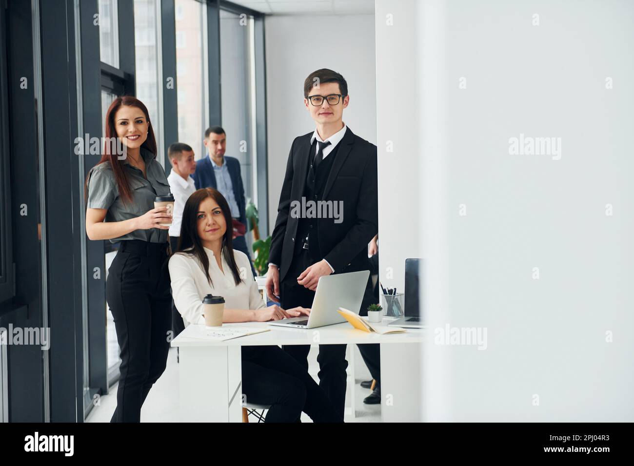 Group of people in official formal clothes that is indoors in the ...