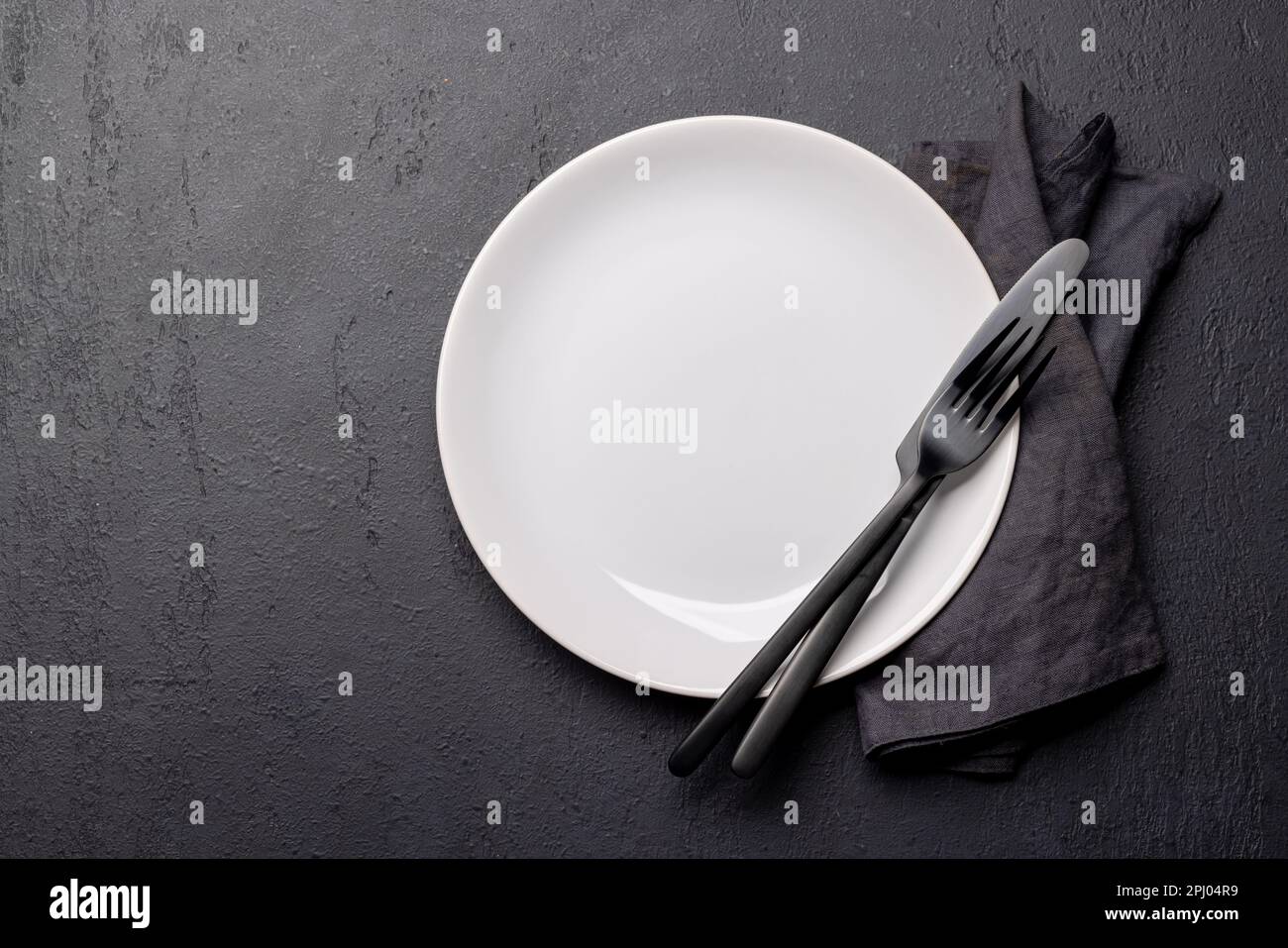 Top-down view of an empty plate and silverware mockup, perfect for ...