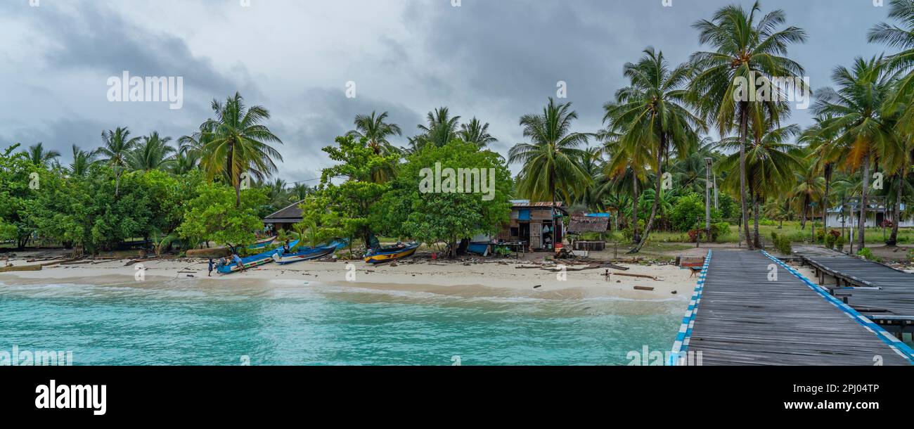 The wooden pier and turquoise sea at Fam island, Raja Ampat, background ...