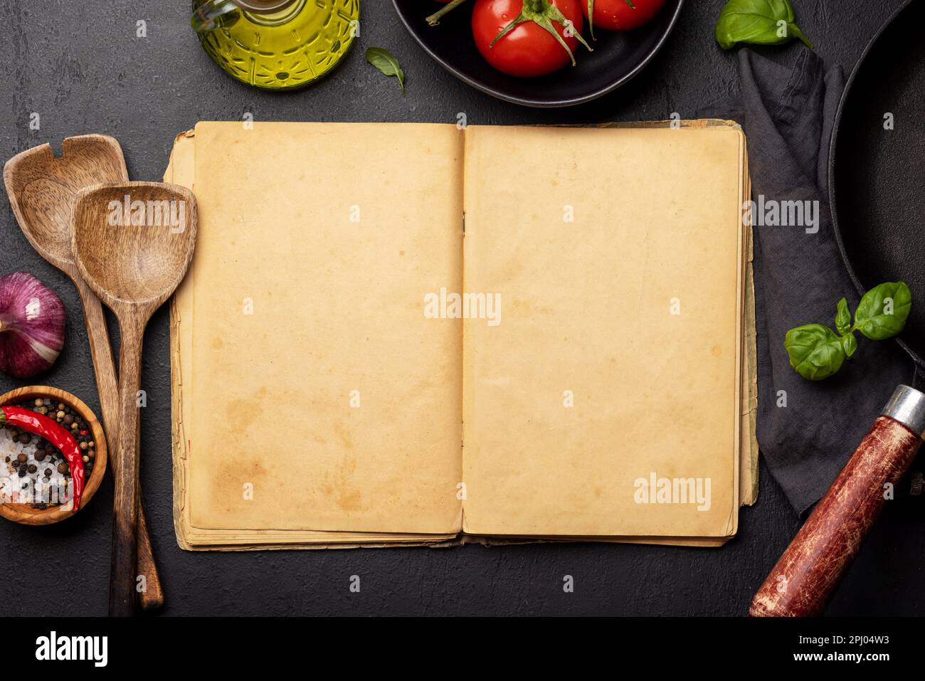 Top-down view of a kitchen table with ingredients, utensils, and an ...