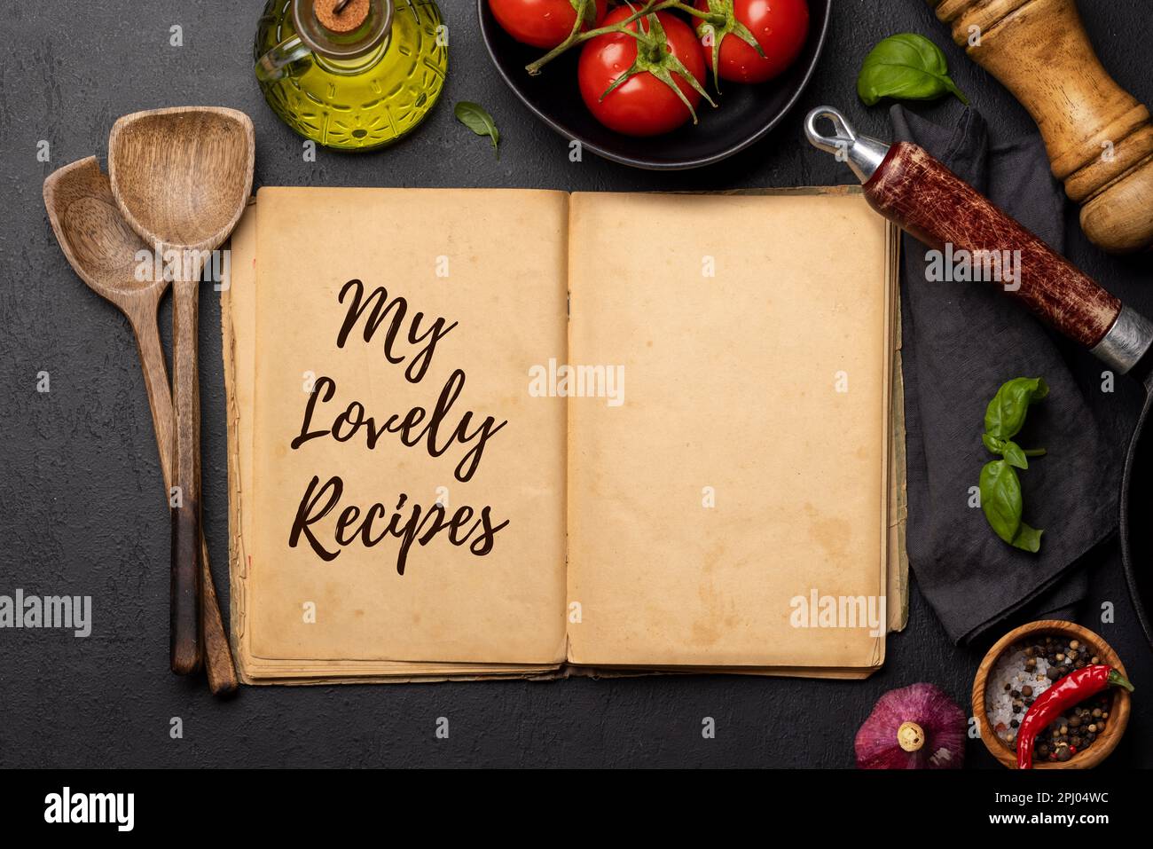 Top-down view of a kitchen table with ingredients, utensils, and an ...