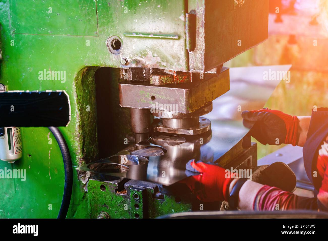 Worker hands bending metal sheet hi-res stock photography and images ...