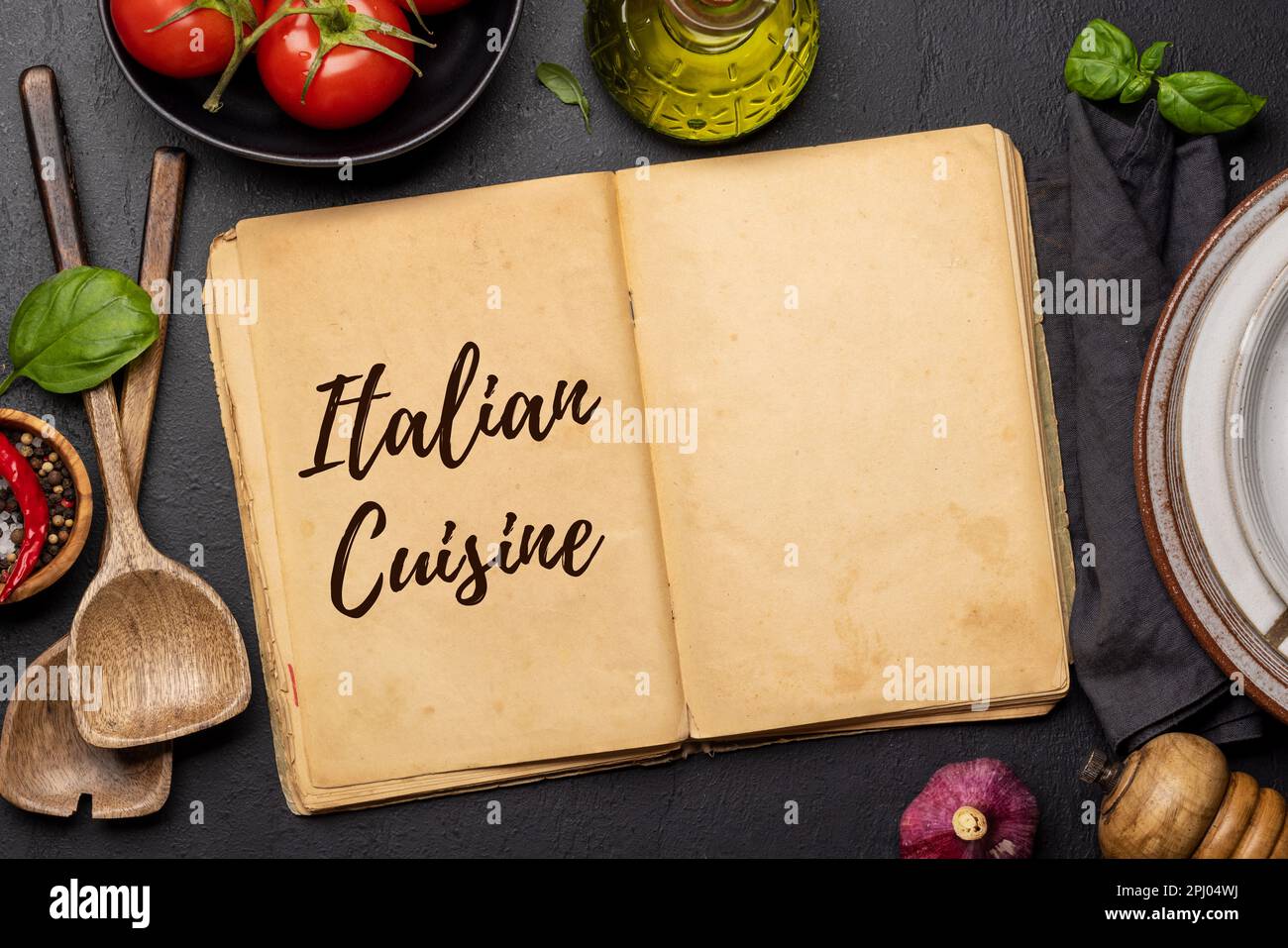 Top-down view of a kitchen table with ingredients, utensils, and an ...