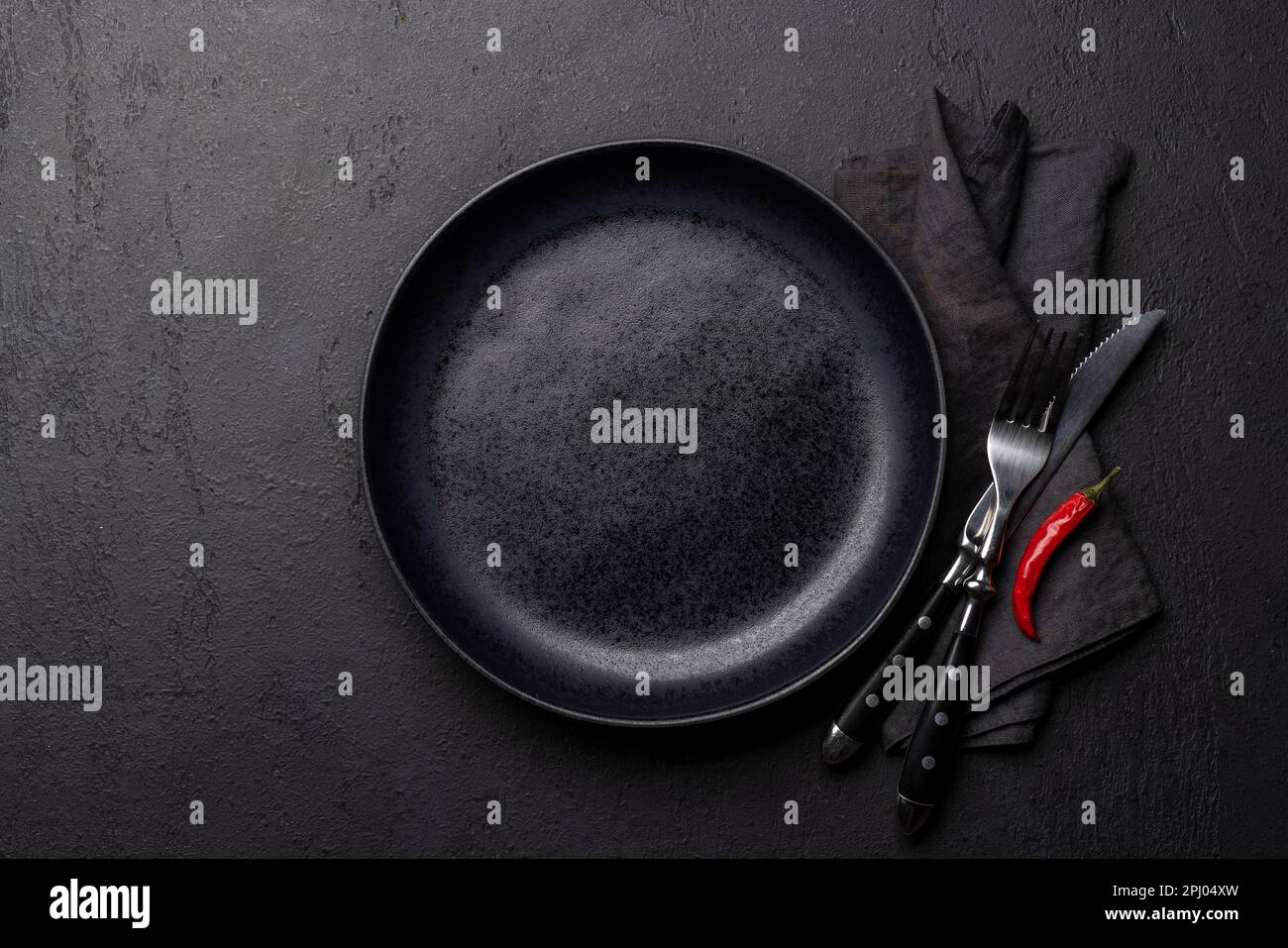 Top-down view of an empty plate and silverware mockup, perfect for ...