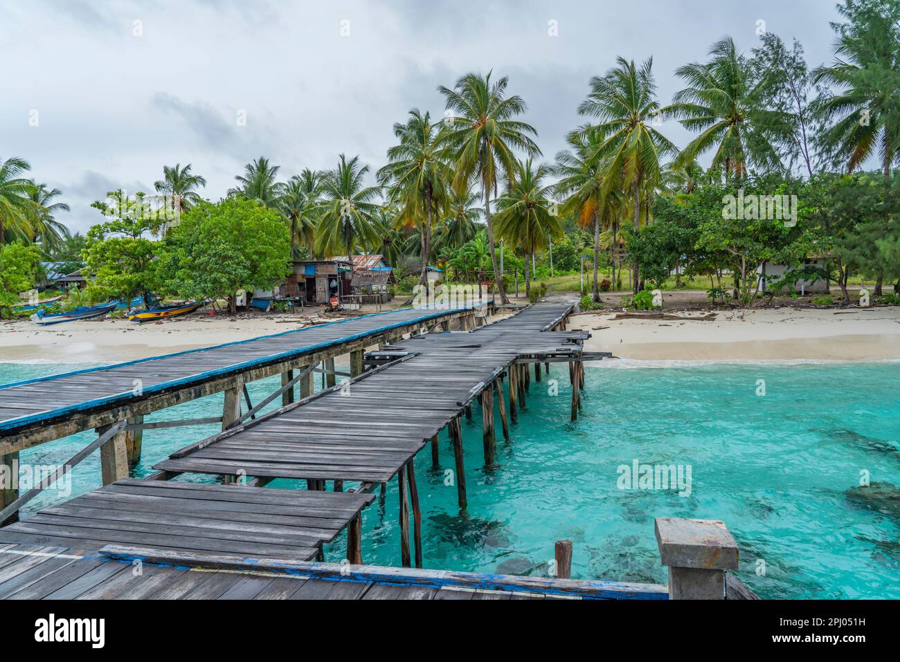 The wooden pier and turquoise sea at Fam island, Raja Ampat, background ...