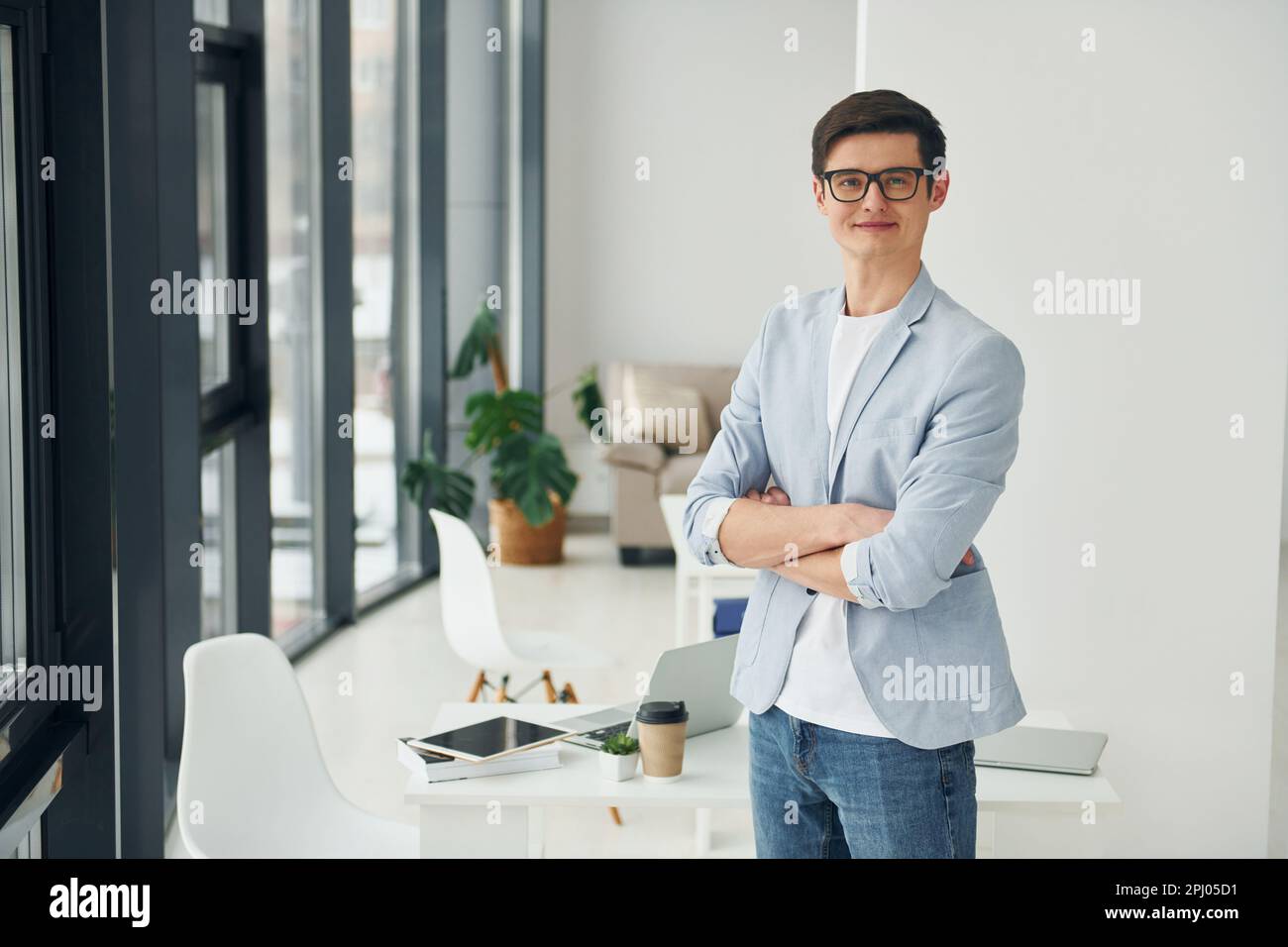 Young guys in glasses and formal clothes standing in the office Stock ...