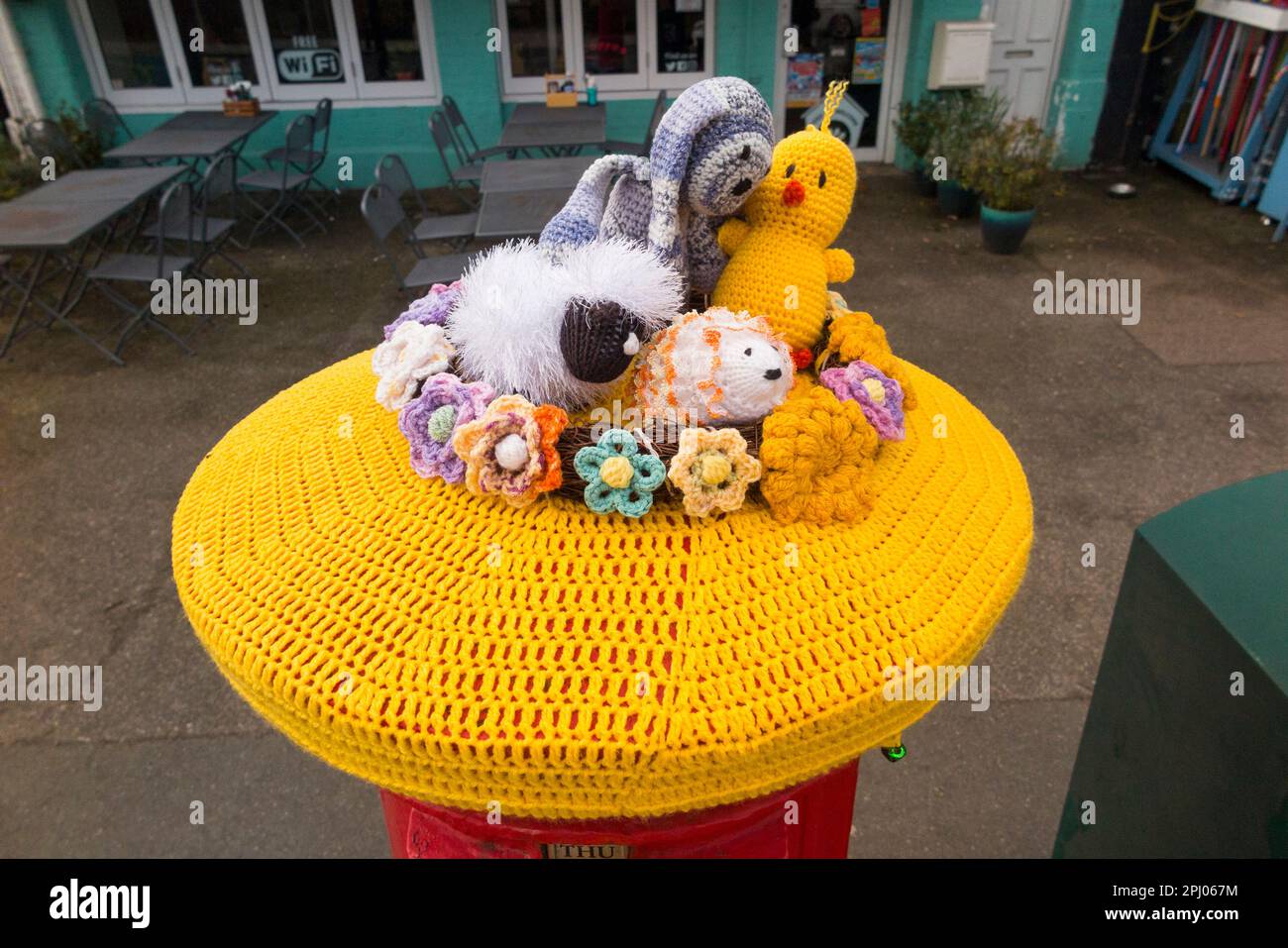 An animal welfare knitted Easter hat topper cap fitted onto the top of ...