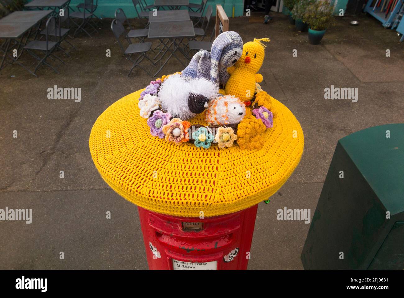 An animal welfare knitted Easter hat topper cap fitted onto the top of ...