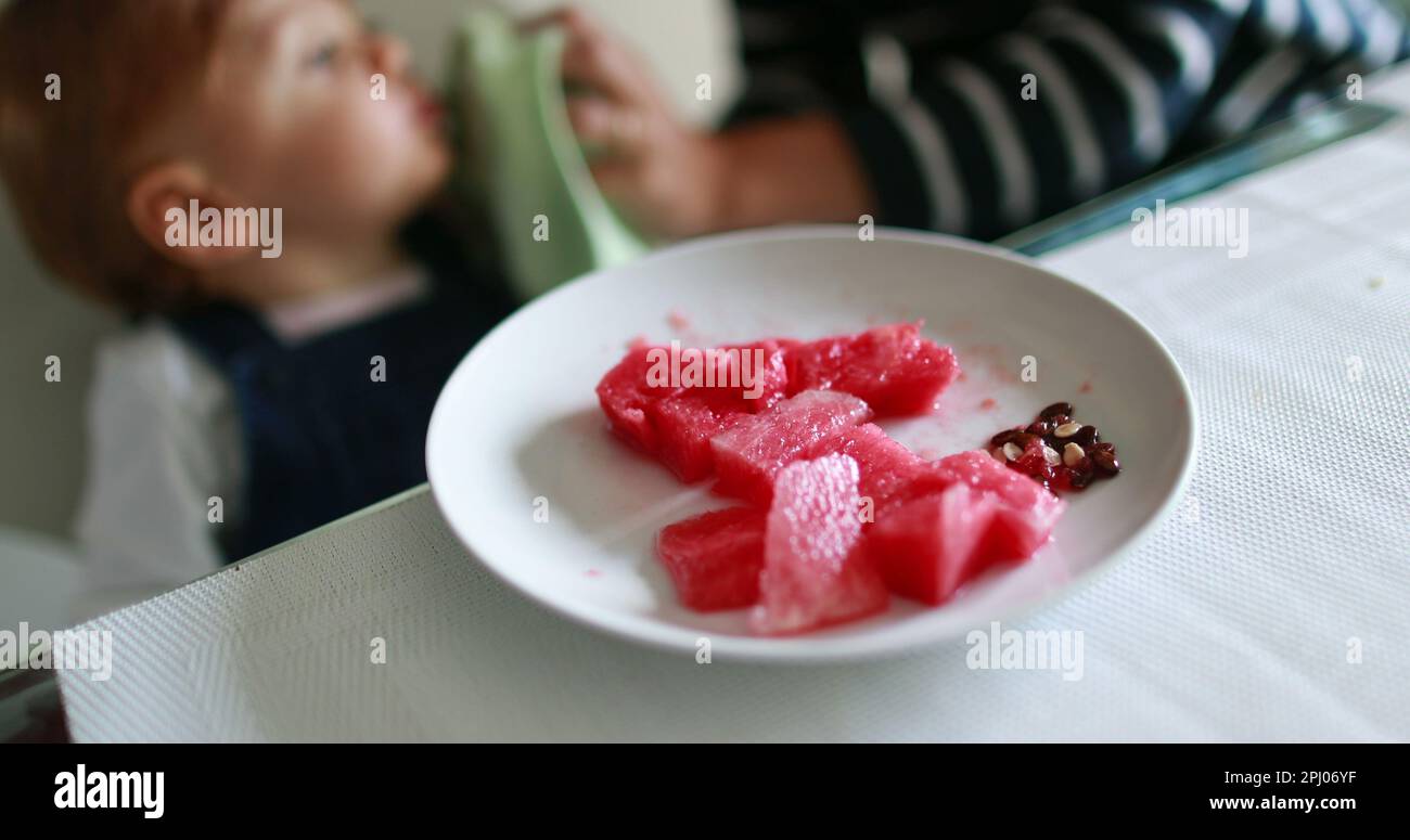 Mother feeding baby son watermelon, one year old toddler eating healthy ...