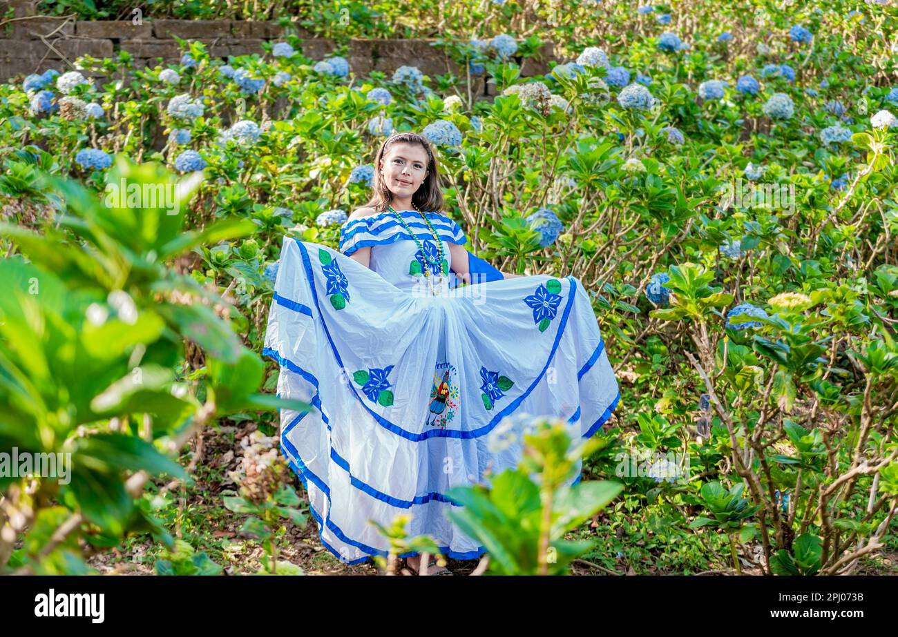 Portrait of young Nicaraguan woman in traditional folk costume in a ...