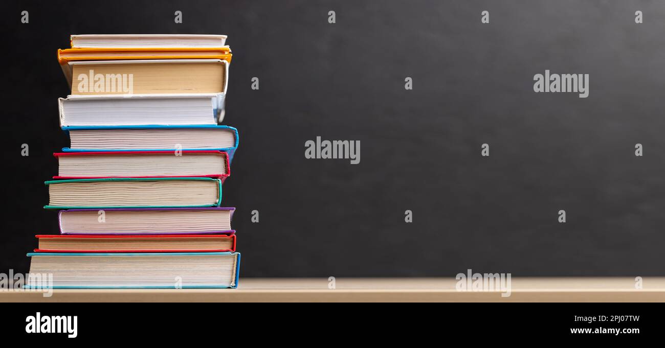 Stack of books on desk with chalkboard and space for creativity Stock ...