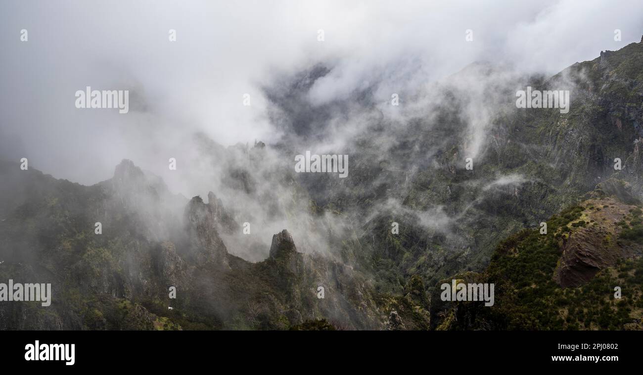 Steep cloudy mountain landscape with rock formations, Pico Arieiro to ...