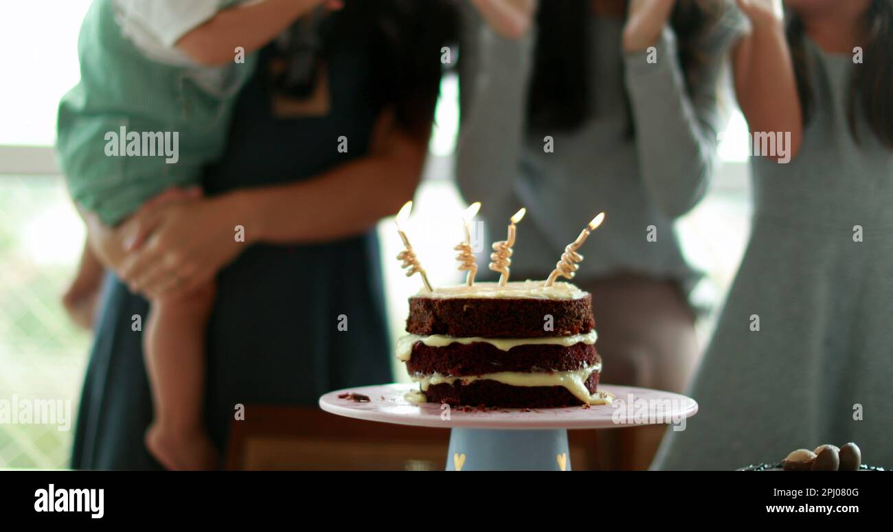 Family celebrating birthday, women clapping hands singing happy ...