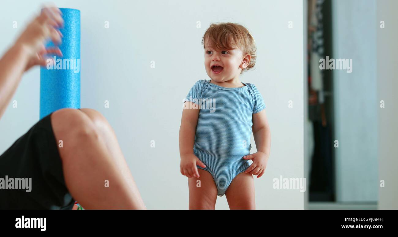 Happy baby dancing, joyful child one year old toddler boy dance moving ...