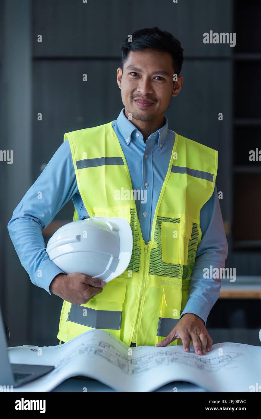 Asian engineer handsome man or architect looking forward with white ...
