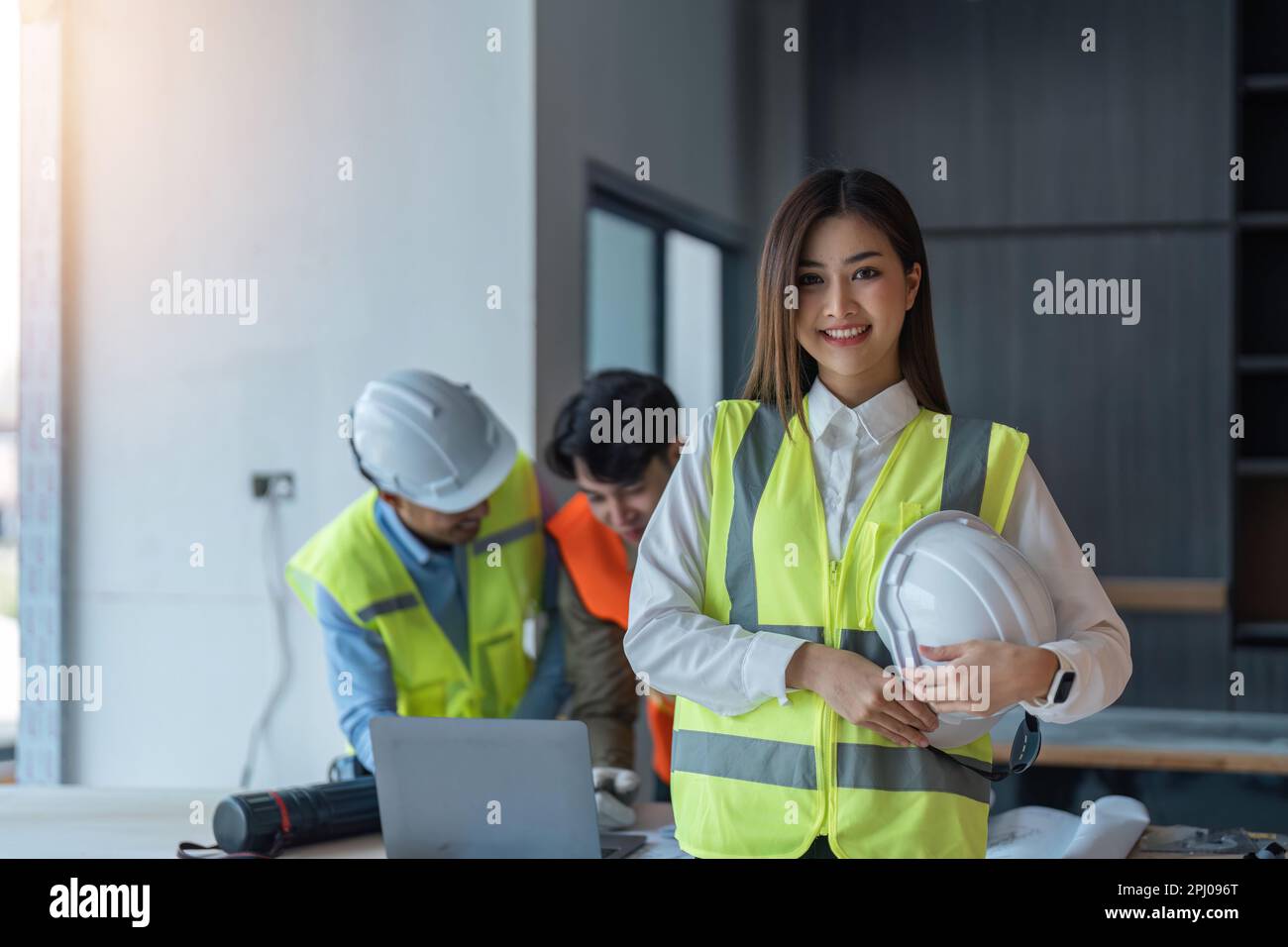 Portrait, construction worker and building with a woman engineer ...