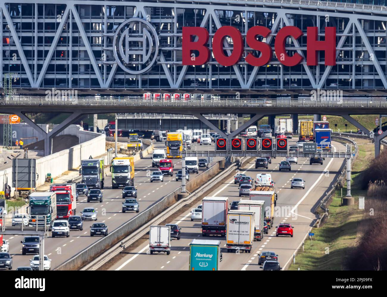 A8 motorway at the airport, the Bosch multi-storey car park spans the road, on the left the ...