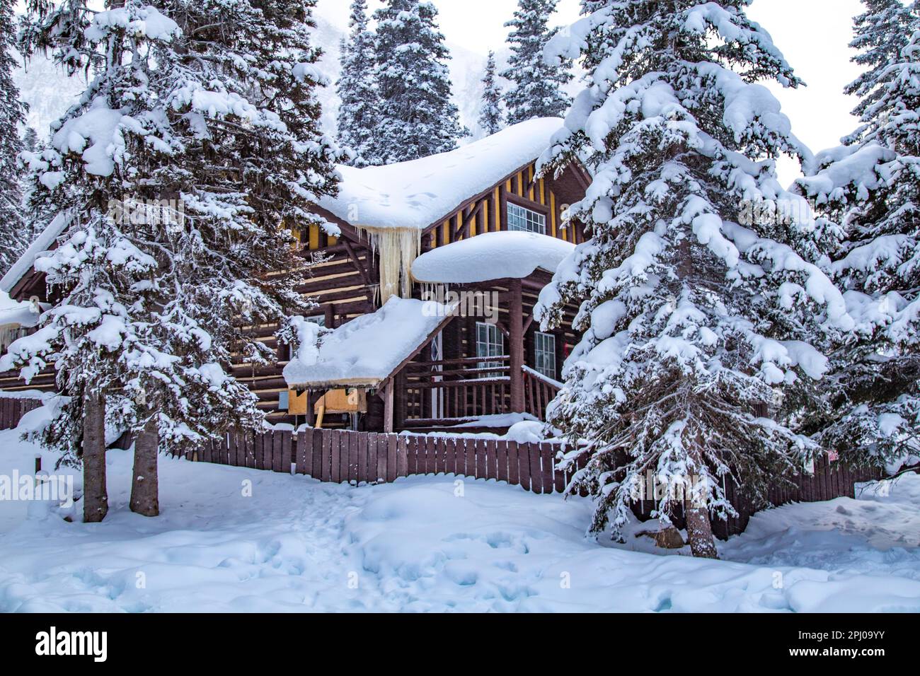 Snowy cabin in winter landscape at Chateau Lake Louise Hotel, Alberta ...
