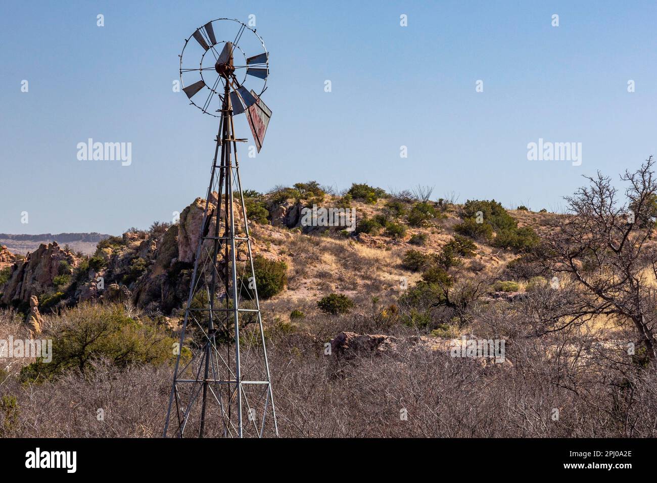Douglas, Arizona, An old windmill, missing many of its blades, on a ...